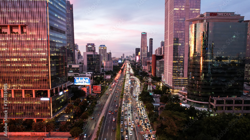 Panoramic cityscape of Indonesia capital city Jakarta at sunset. A rare ...