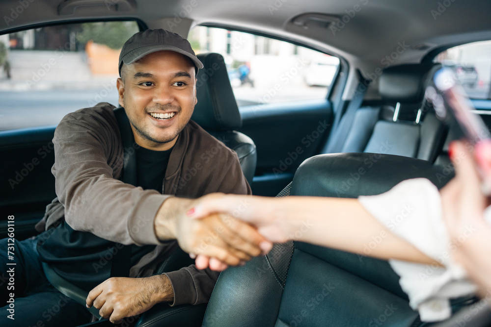 Young asian taxi driver sending and passenger to direction destination ...