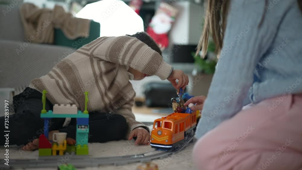 Creative Playtime - Kids Engrossed in Building Railroad Track and Train ...