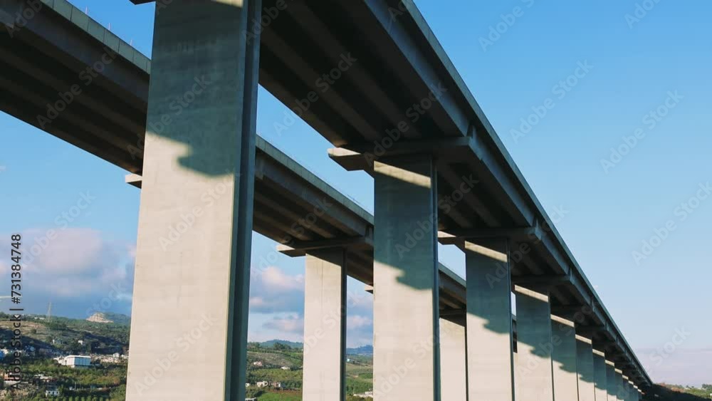 Drone view of mountain expressway's concrete viaduct. Viaduct spans ...