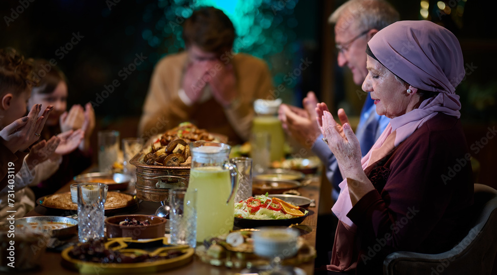 In a modern restaurant setting, a European Islamic family comes ...