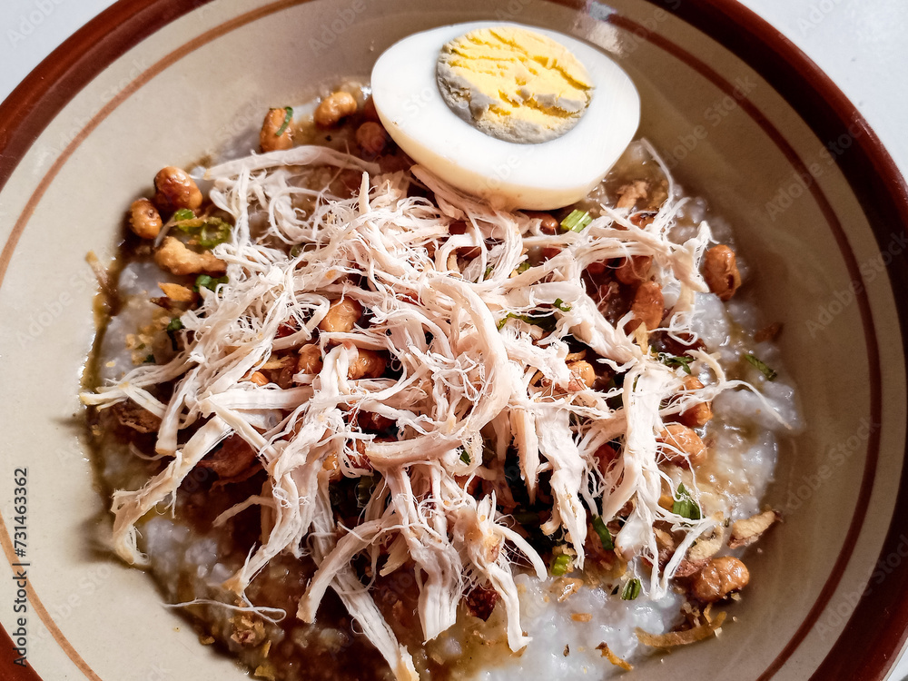 Bubur ayam or chicken congee is Chinese Indonesian rice porridge topped ...