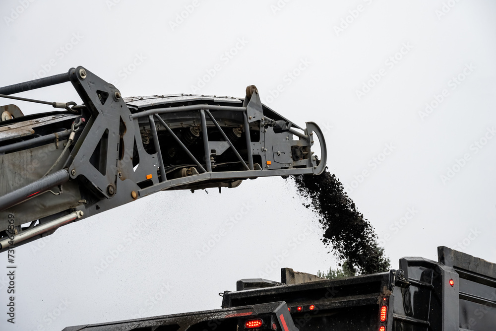 Road construction, asphalt milling machine (cold planer) grinding up ...
