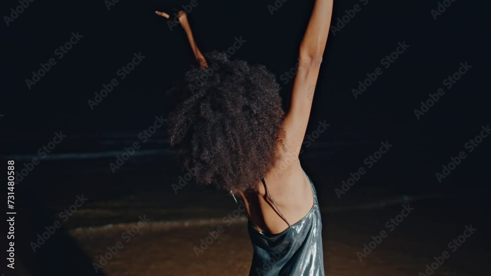 Chill girl move hands on beach party back view. Slim woman body in ...