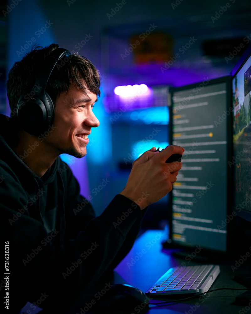 Low Key Lighting Shot Of Male Gamer In Front Of Computer Screens With ...