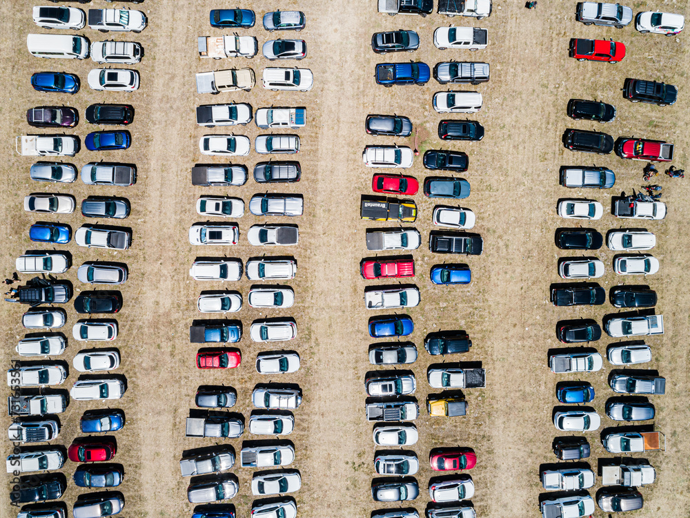 Top down aerial photo of cars in overflow parking in paddock during ...