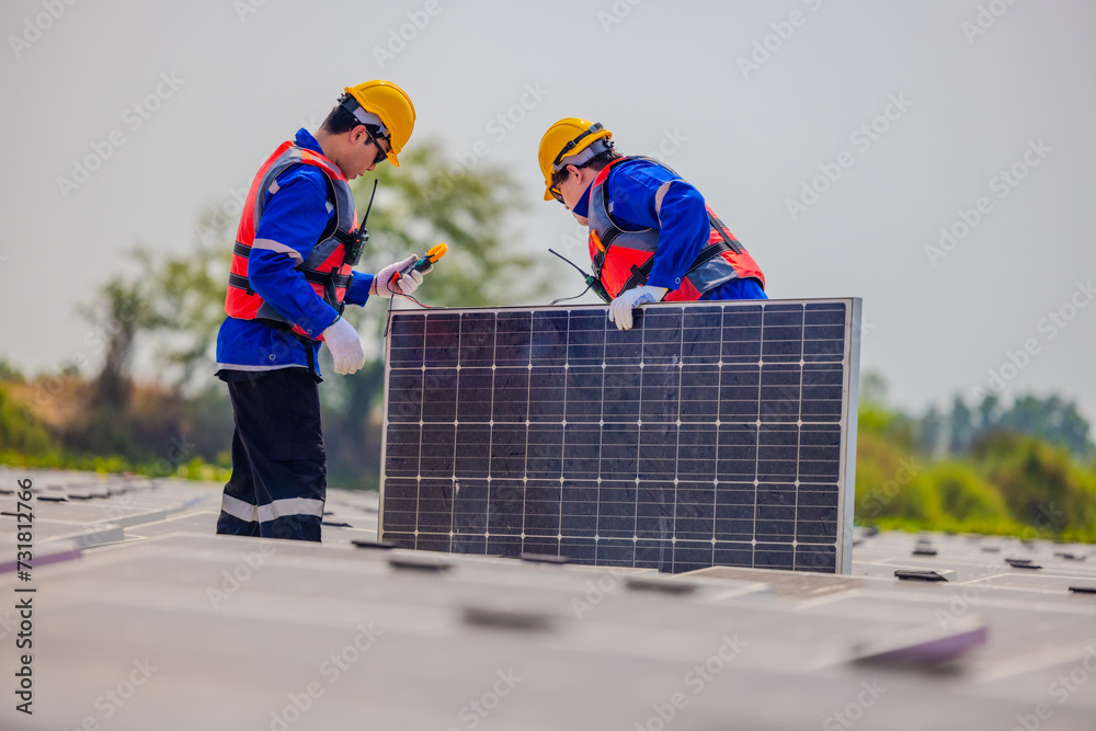 Technicians check floating solar farm wiring, polarity, and grounding ...