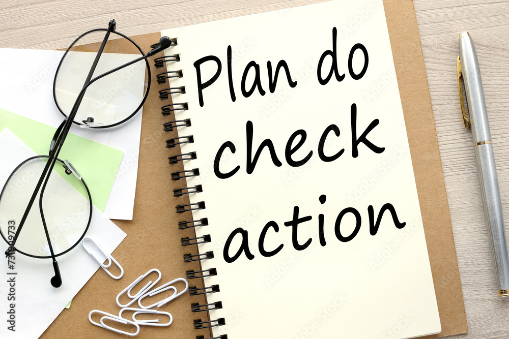 PDCA plan do check action open notepad with text. glasses on a notepad ...