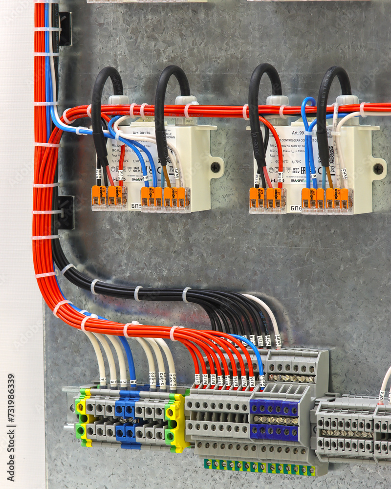 Electronic control modules for apartment automation are installed in an ...