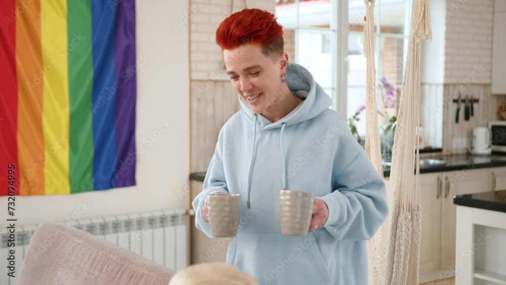 A tender morning scene unfolds as a woman in a blue hoodie brings a cup ...