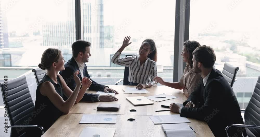 Confident happy young African business leader woman giving group high ...