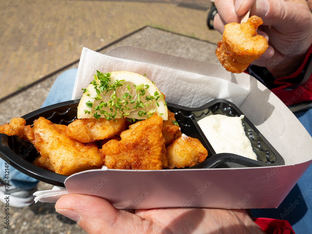 Kibbeling, Dutch snack of fried fish nuggets with slice of lemon and ...