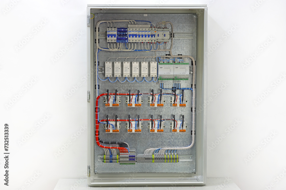 An electric panel for lighting control with power modules on a metal ...