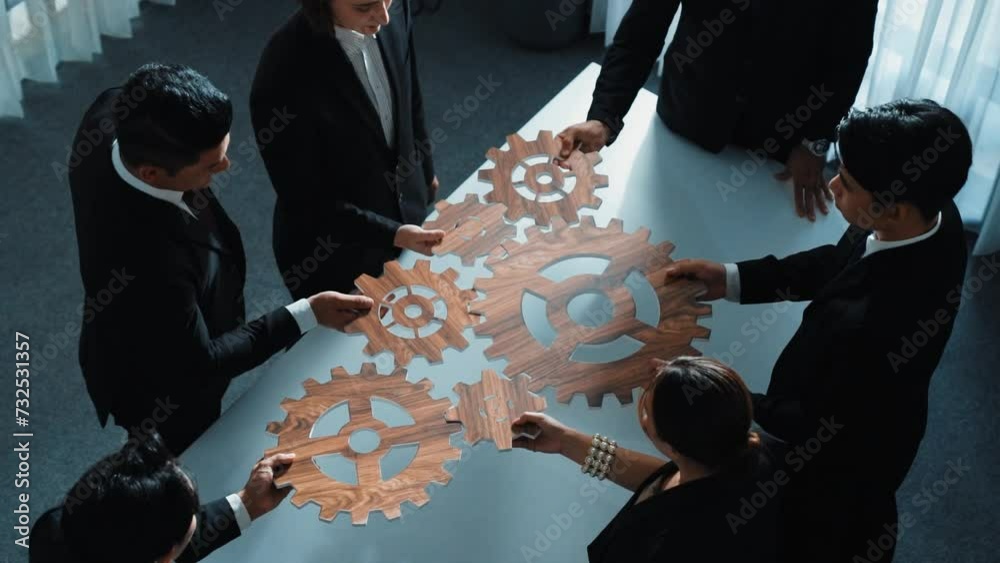 Top view of professional business team bring filled last cog to ...