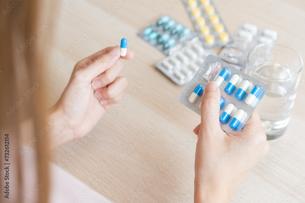 Sick ill asian young woman, girl hand taking tablet pill capsule out ...
