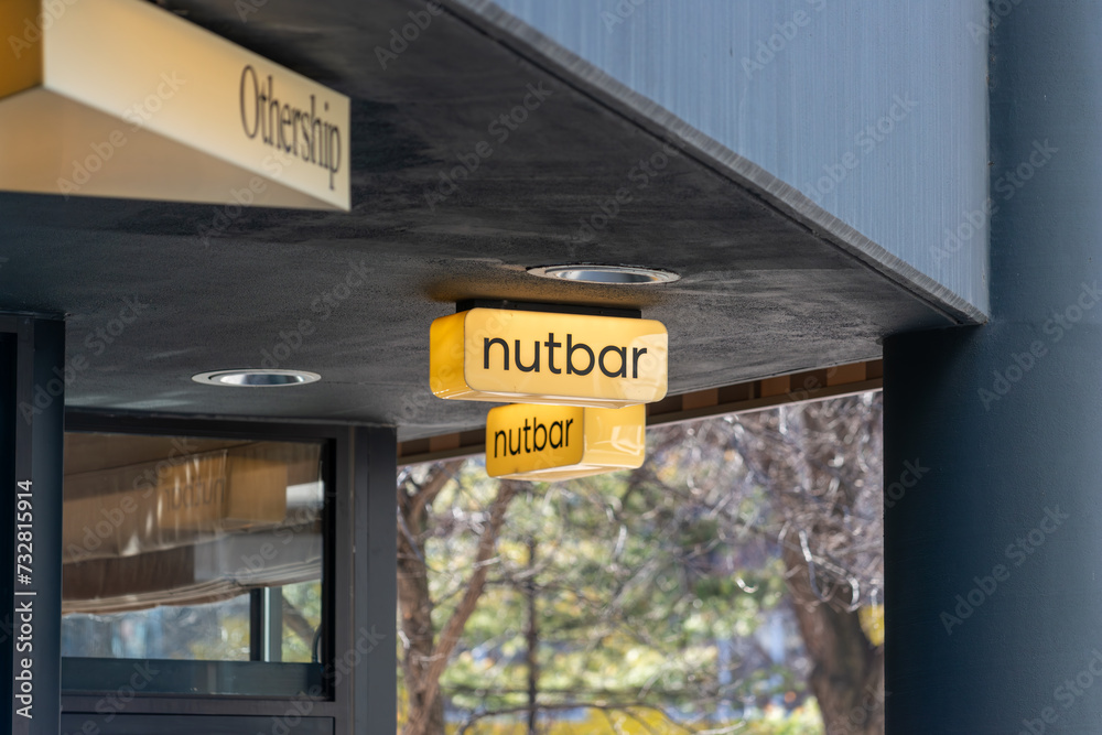exterior building and lamp signs of nutbar, a health food restaurant ...