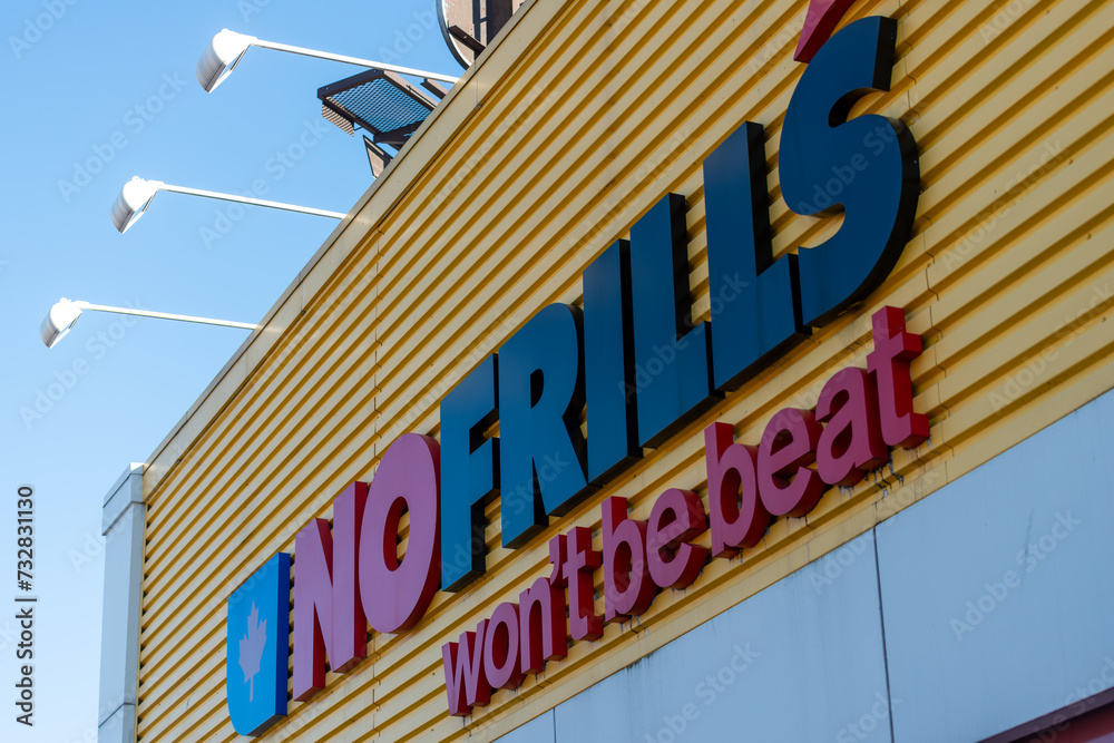 exterior facade and sign of No Frills, a discount supermarket, located ...