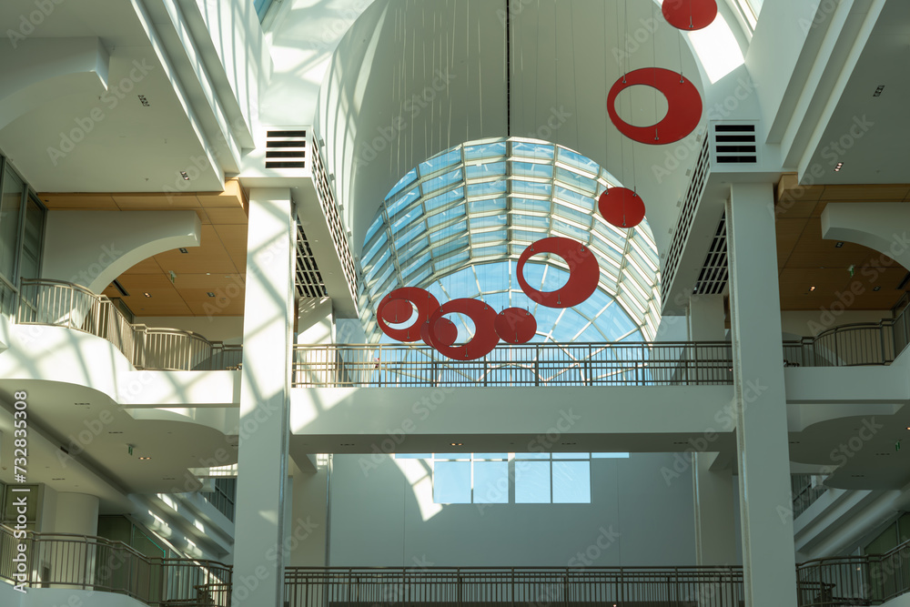 glancing up at the mobile sculpture installation and barrel vaulted ...