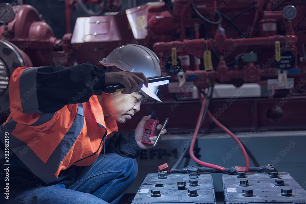 Engineer checking battery on Fire engine room. People Preventive ...
