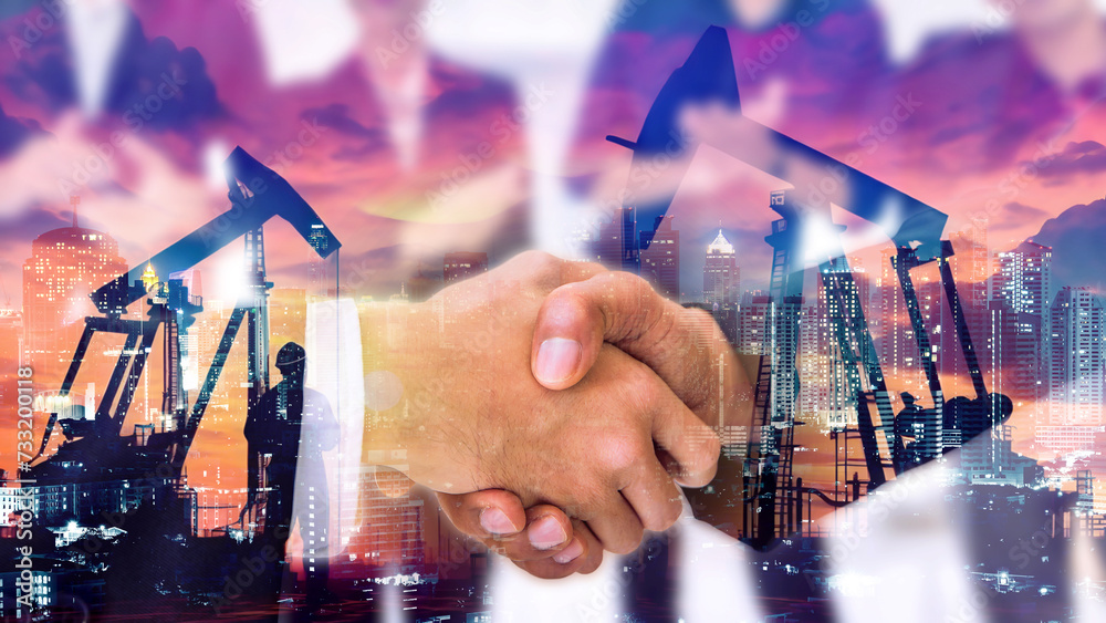 Double exposure of businessman handshake with Crude Oil pump oil rig ...
