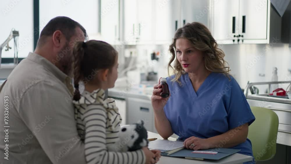 Doctor explaining test results to father of young girl patient. Concept ...