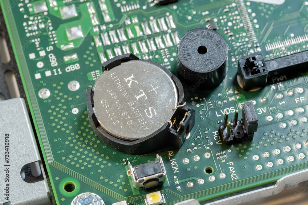 Detailed close-up view of a CMOS battery installed on a computer ...