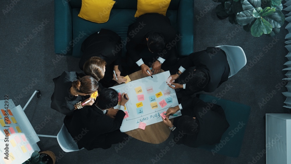 Close up of professional business team hands writing and putting sticky ...