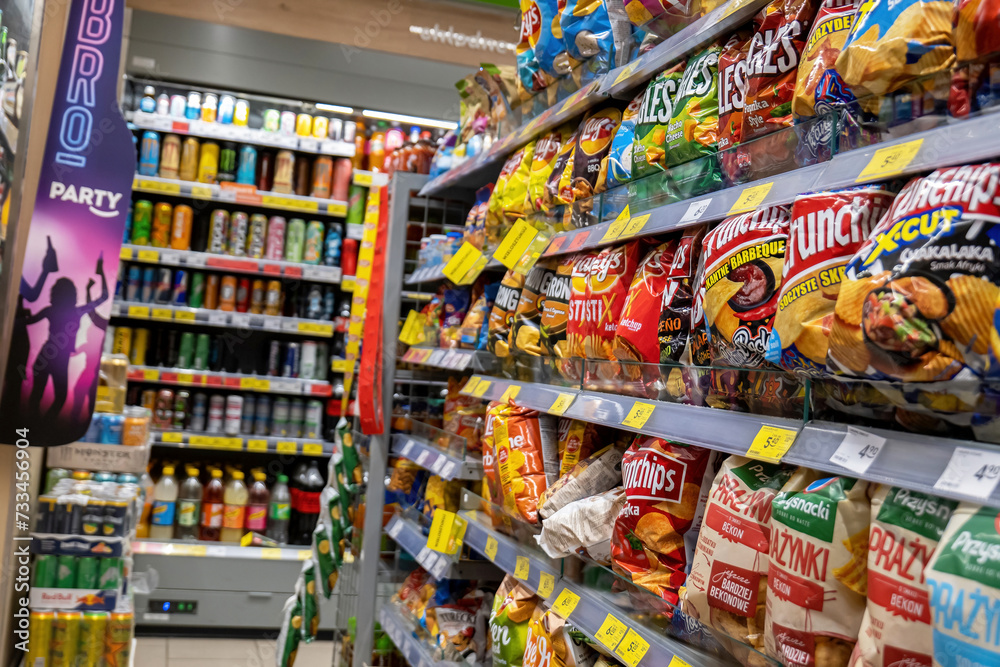 Convenience store alley with chips crisps party snacks and energy ...