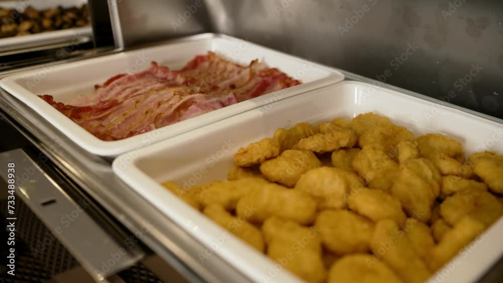 Close-up of food in a restaurant, on the table. Bacon and buffet in the ...