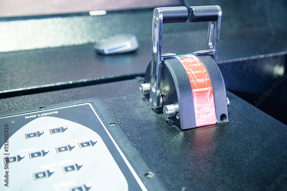 Ship engine throttles and control panel wheelhouse in navigation deck ...