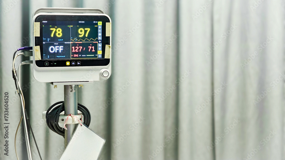 Vital signs monitor showing Heart rate and blood pressure of patient in ...