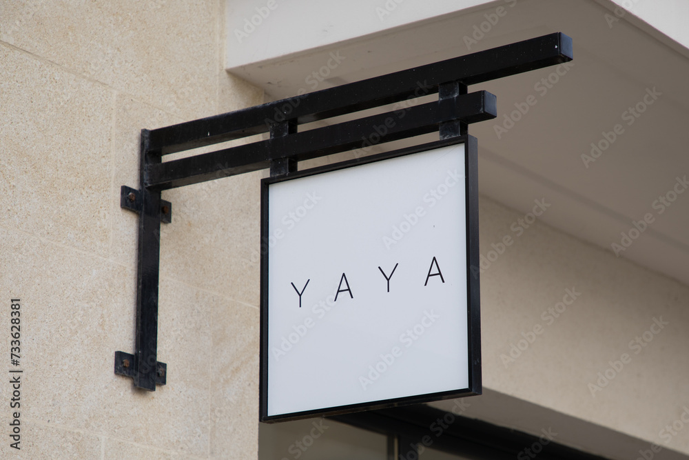 YAYA logo text and brand sign clothes facade entrance store signage on ...