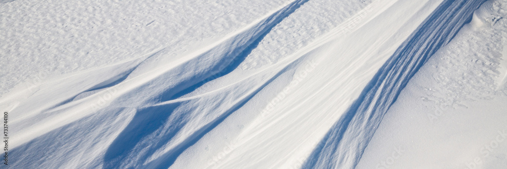 Snow texture. Wind sculpted patterns on snow surface. Wind in the ...