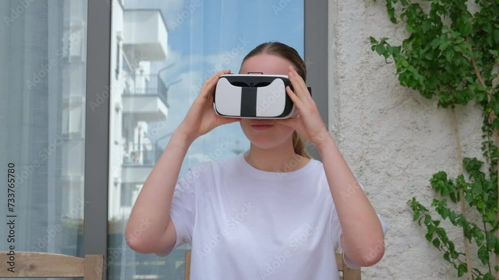 VR.woman uses VR glasses in everyday life at home, augmented reality ...