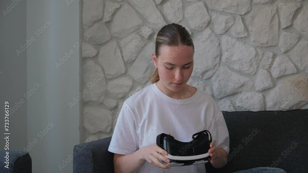 VR.woman uses VR glasses in everyday life at home, augmented reality ...