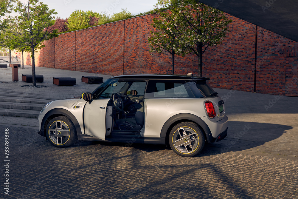 First fully electric Mini parked with driver's door open.. The Mini has ...