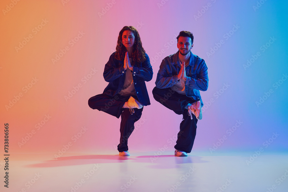 Dance duo, talented man and woman in dance poses against gradient ...
