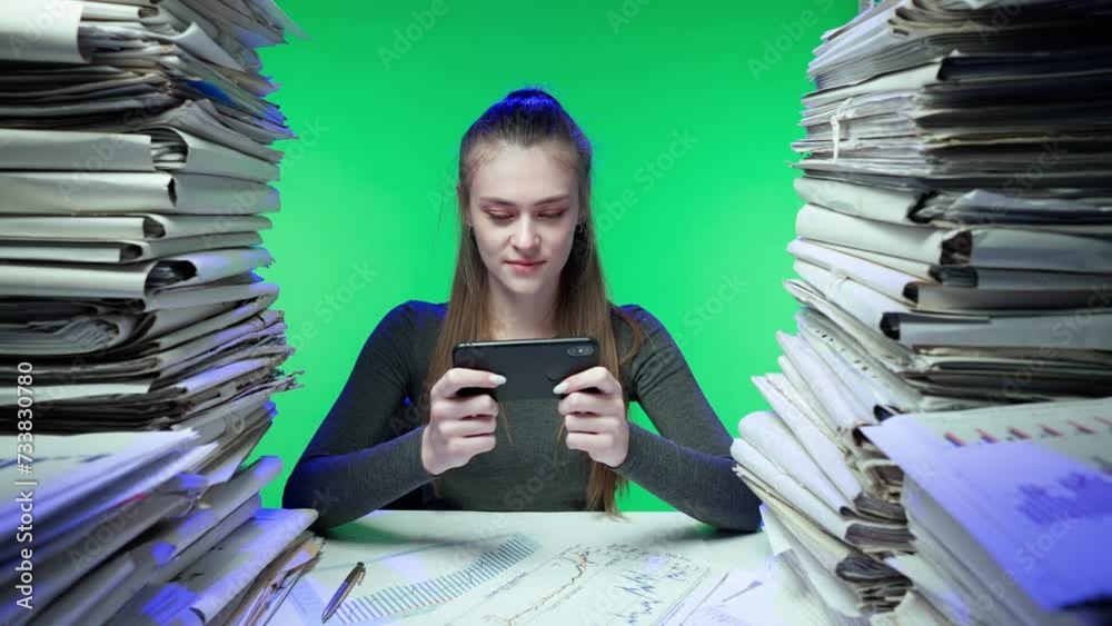 Exhausted young business woman office employee at the desk working late ...