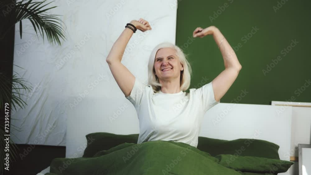 Senior woman Laying in Bed is Waking Up in the Morning After Sleeping ...