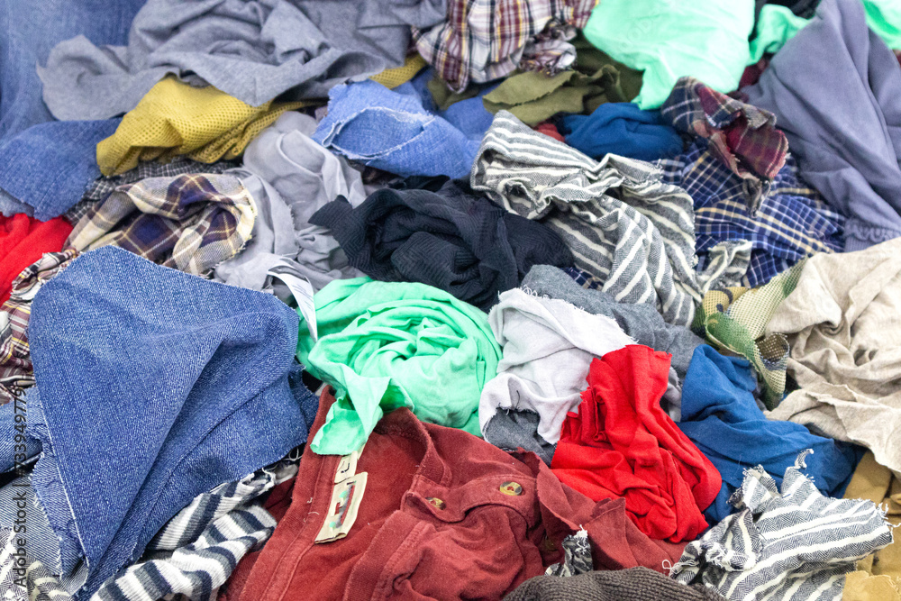 Textile scrap background. Lots of textile fabric scraps. Textile waste ...