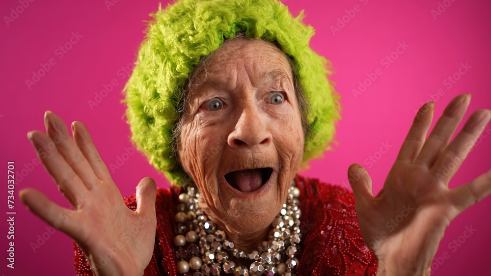 Funny elderly senior old woman with no teeth and wrinkled skin gives ...