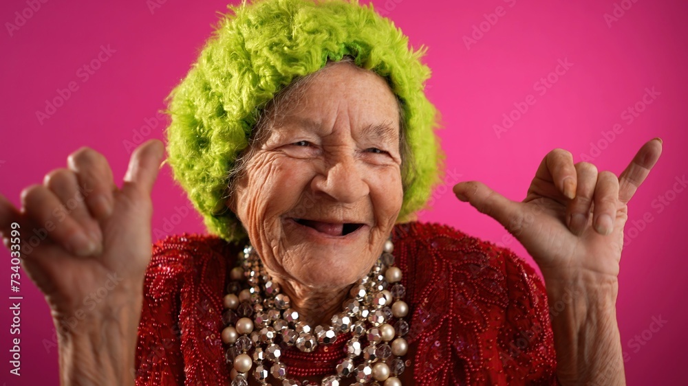 Fisheye view of funny elderly mature woman, 80s, wearing green wig ...
