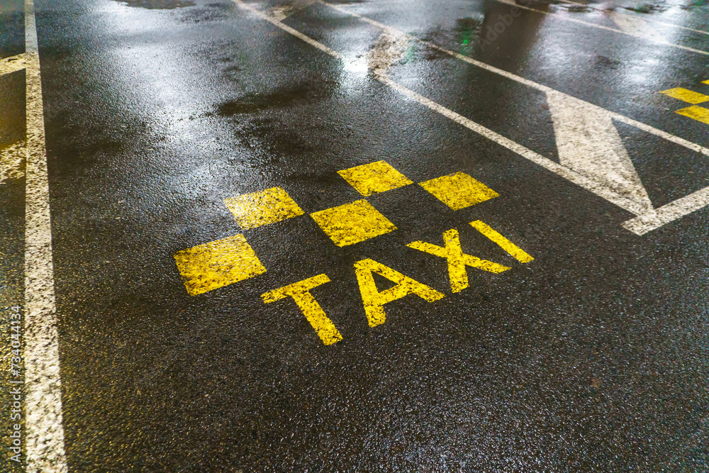 "Taxi" road markings. The place where taxis and fixed-route vehicles ...