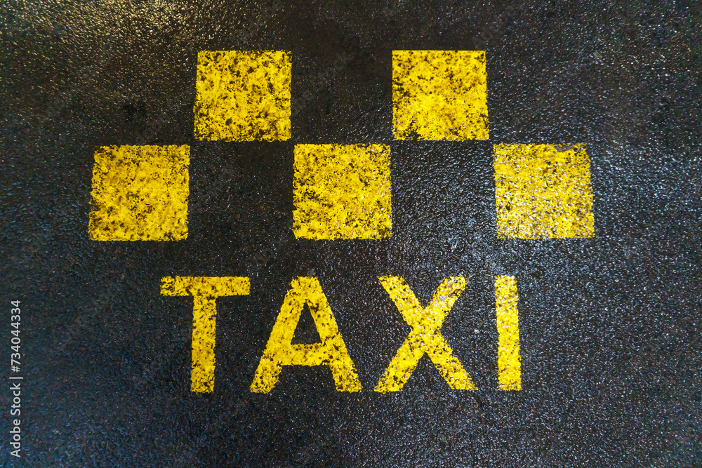 "Taxi" road markings. The place where taxis and fixed-route vehicles ...