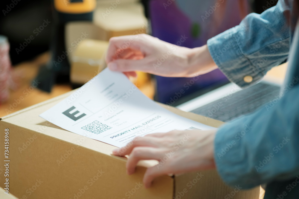 Attaching Shipping Label to a Parcel Stock Photo | Adobe Stock