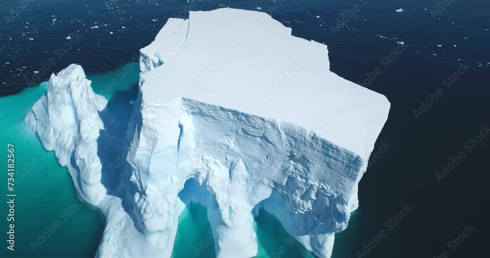 Vidéo Stock Antarctica giant iceberg melting in blue water aerial top ...