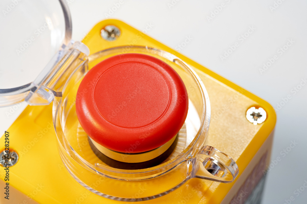 Detailed closeup view of a red emergency stop button industrial machine ...