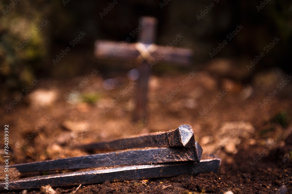 Christian wooden cross and hammer with metal Nails on ground Stock ...