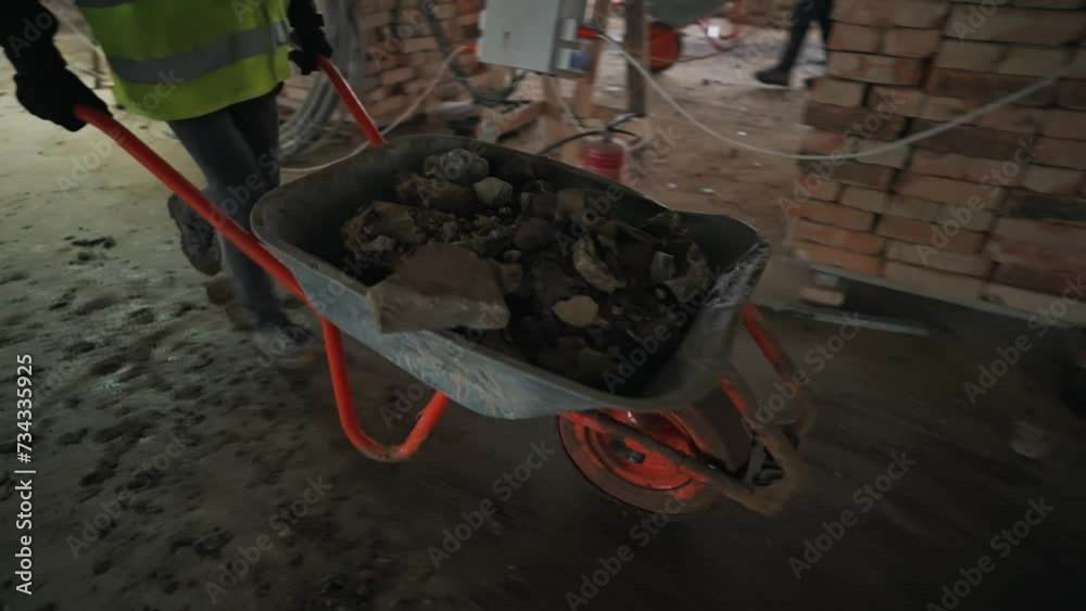 Vidéo Stock Male workers stack pieces of concrete floor into a ...