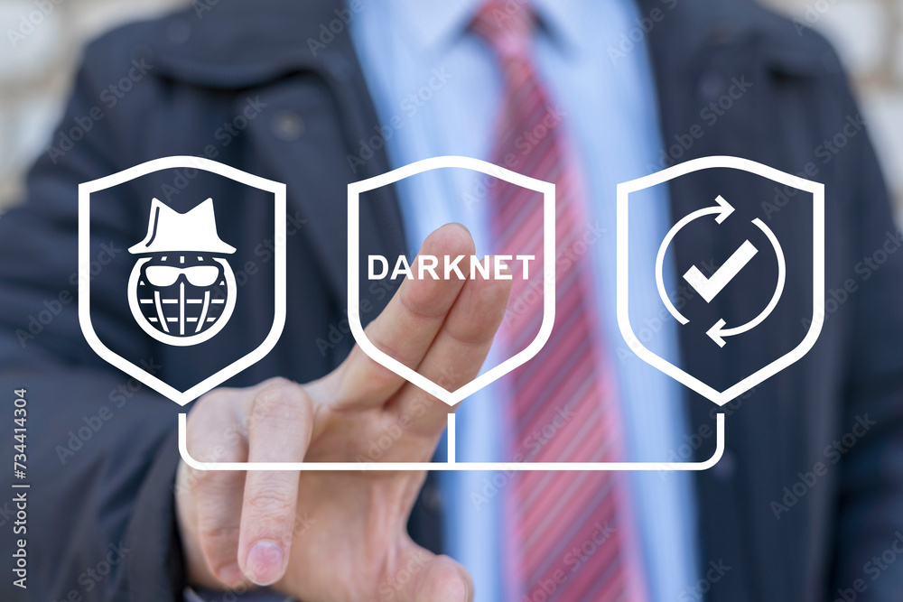 Businessman using virtual touchscreen presses word: DARKNET. Darknet and cybersecurity concept ...